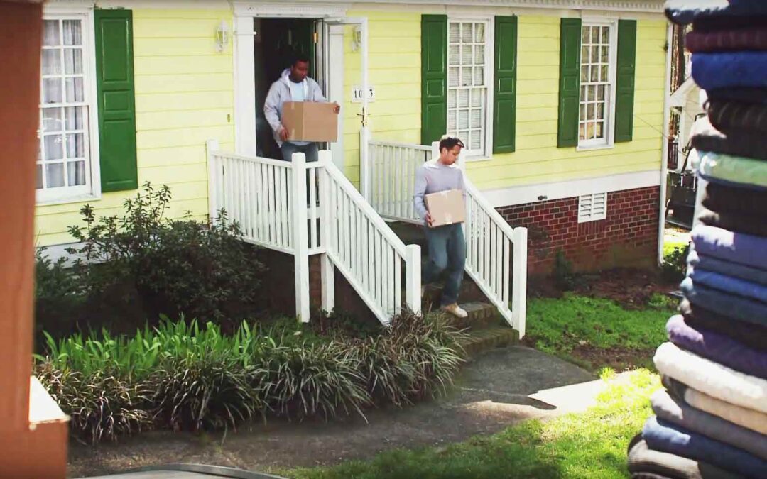 two men moving boxes - MovingSham